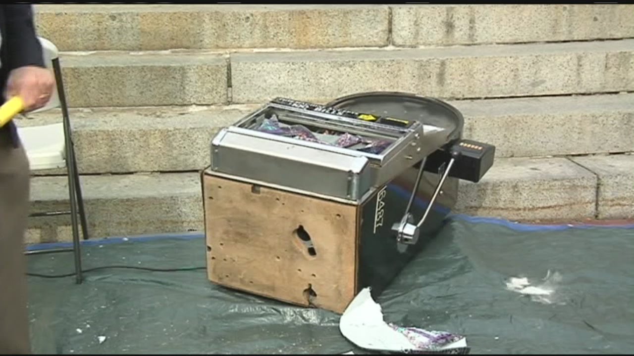 Casino opponents destroy a slot machine on the State House steps - YouTube