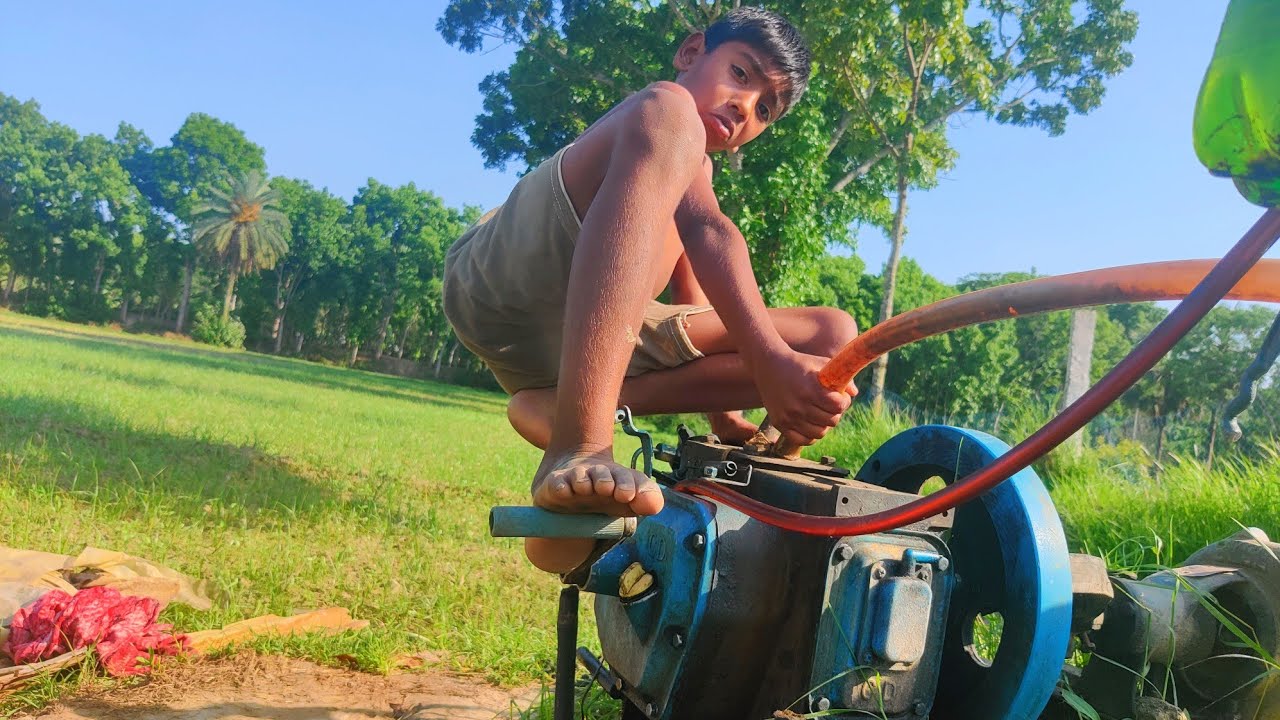 The village boy Sifat is running the cell machine at full speed he is ...