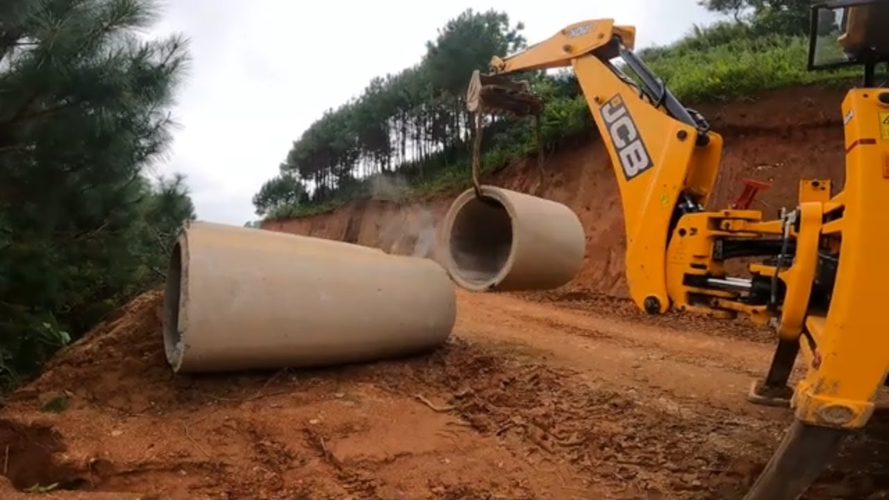 jcb installing road culvert pipe || jcb installing a big pipe || jcb vs ...