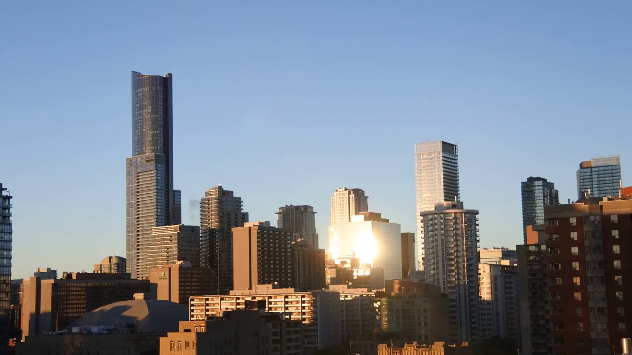 Buildings glowing in the morning sun - YouTube