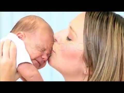 Loving Mother Kissing Baby Daughter. Stock Footage