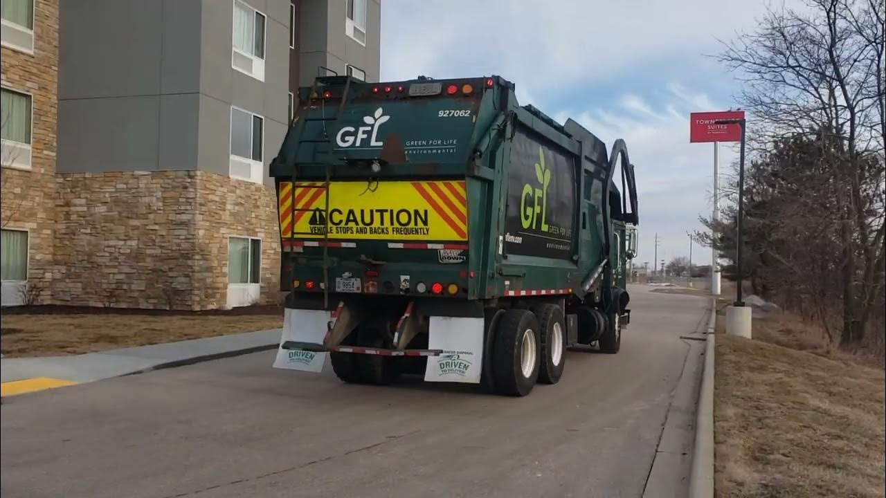 GFL Environmental Mack Heil front loader garbage truck unloading a ...