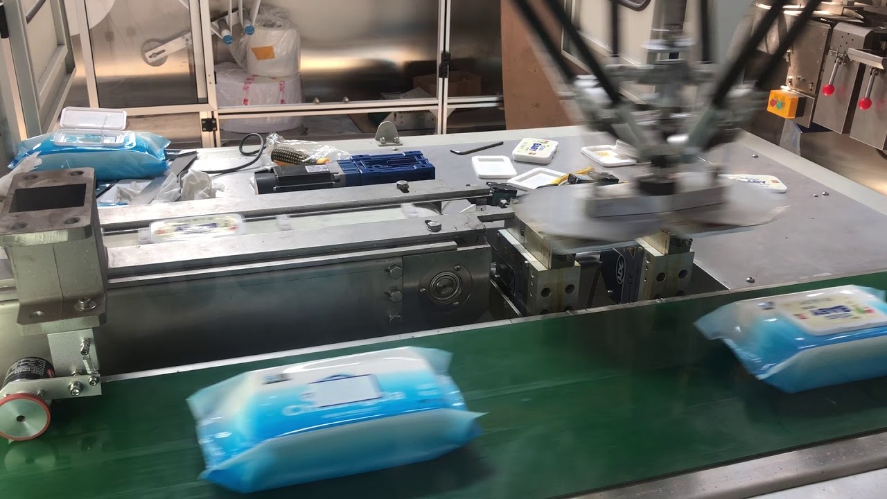 Robot arm plastic lid machine - YouTube