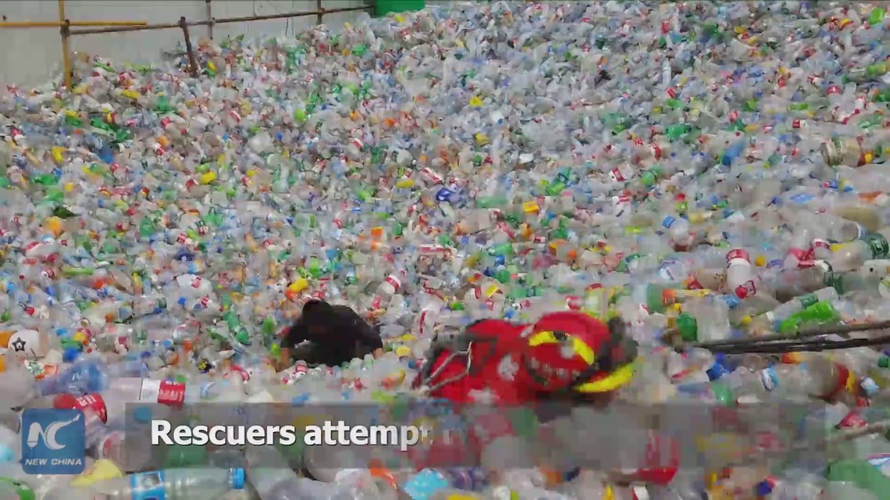 Man trapped in "sea of bottles", rescued by firefighters - YouTube