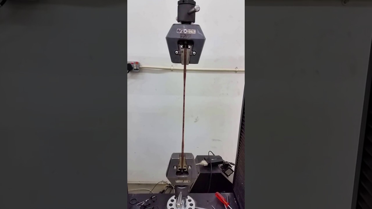 Tensile testing of rubber - YouTube