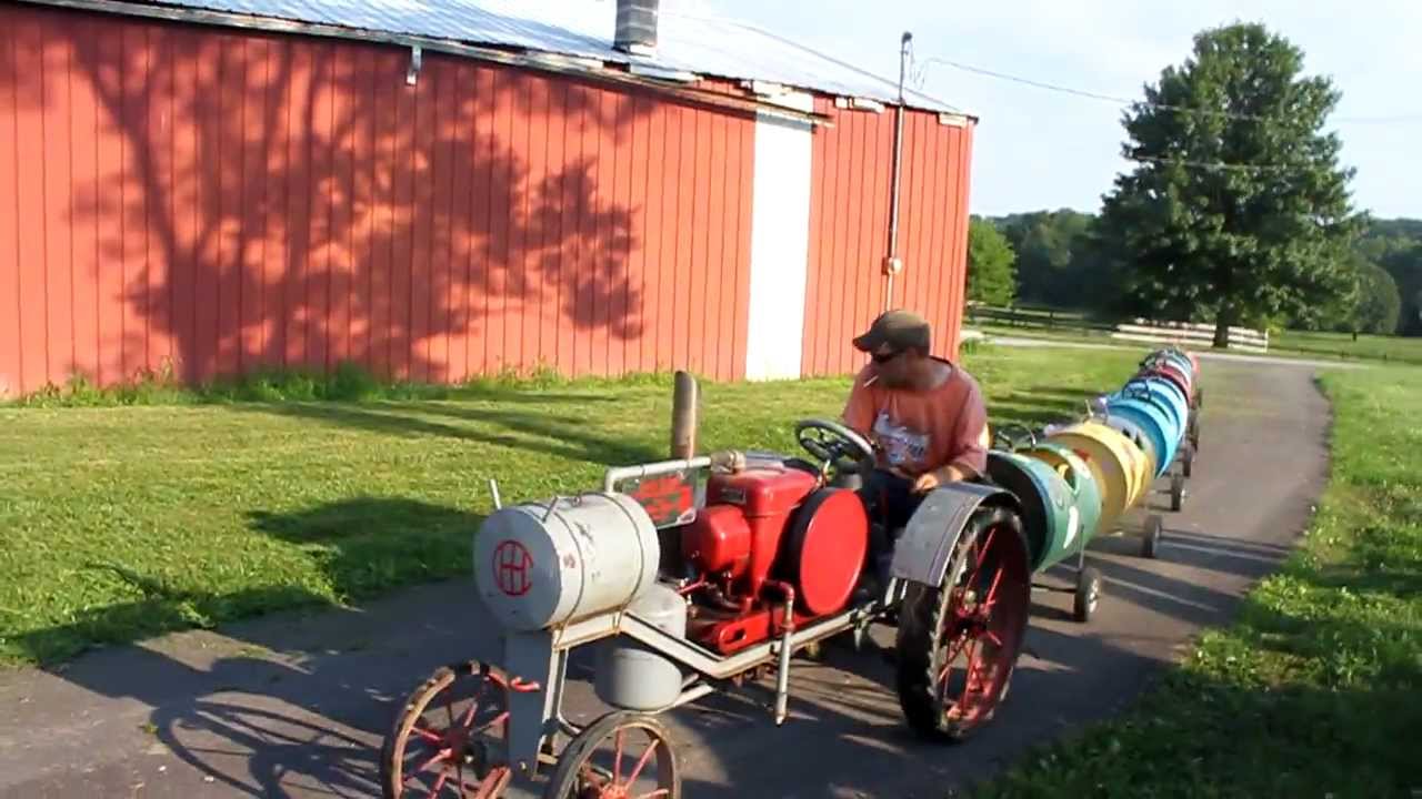 1919 Titan tractor pulling a train - YouTube