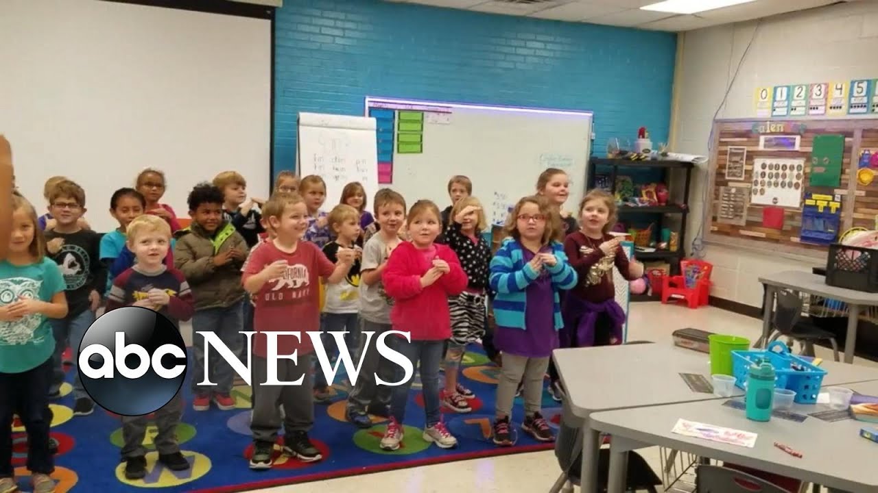 Students learn sign language for beloved janitor - YouTube