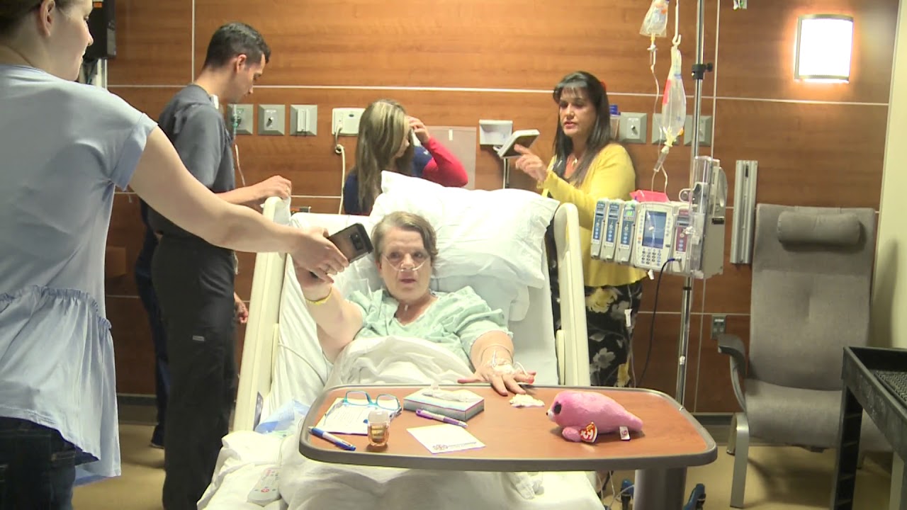 Nursing staff holds a graduation watch party for patient - YouTube