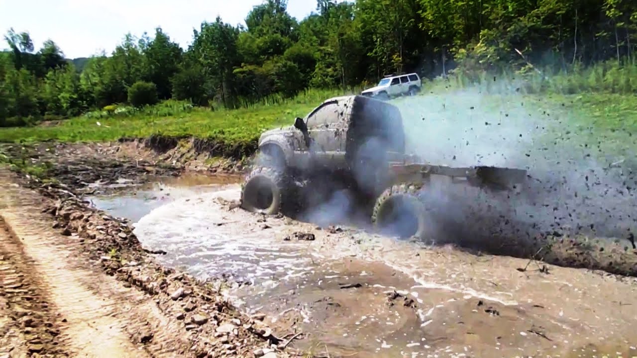 Black And Red Ford Truck Clears The Tank Trap At Wolf Springs Mud Bog ...