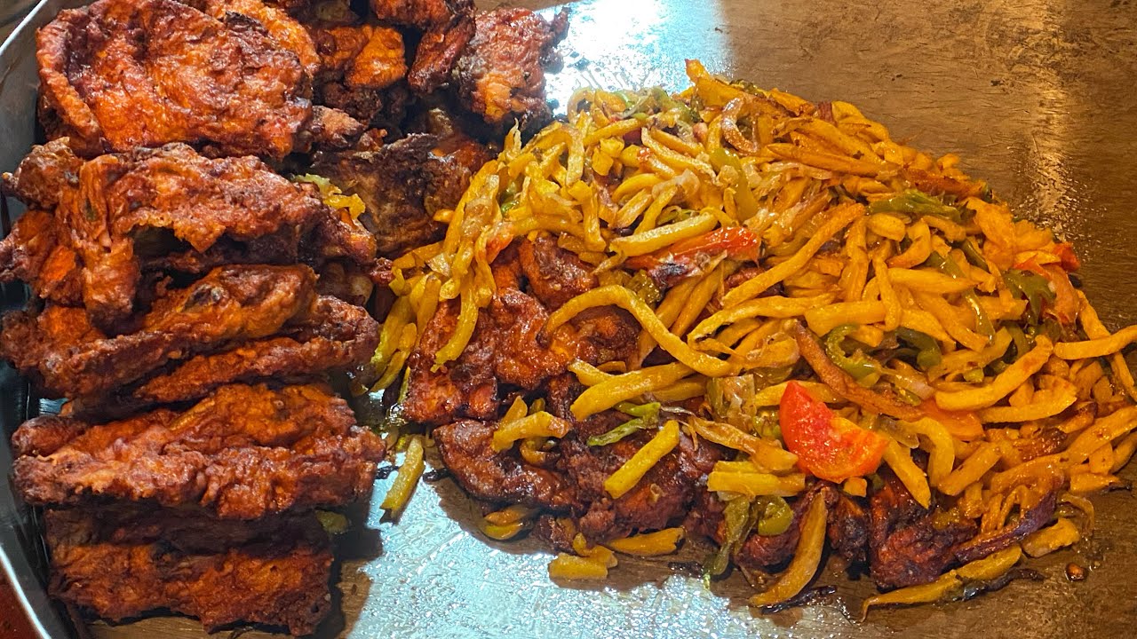 Eating Chicken Chaap Served With Green Chilli, Potato Fries, Capsicum ...