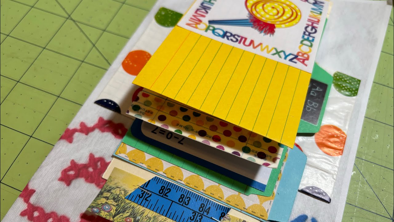 Sliding waterfall embellishment using a variety of of papers for the ...