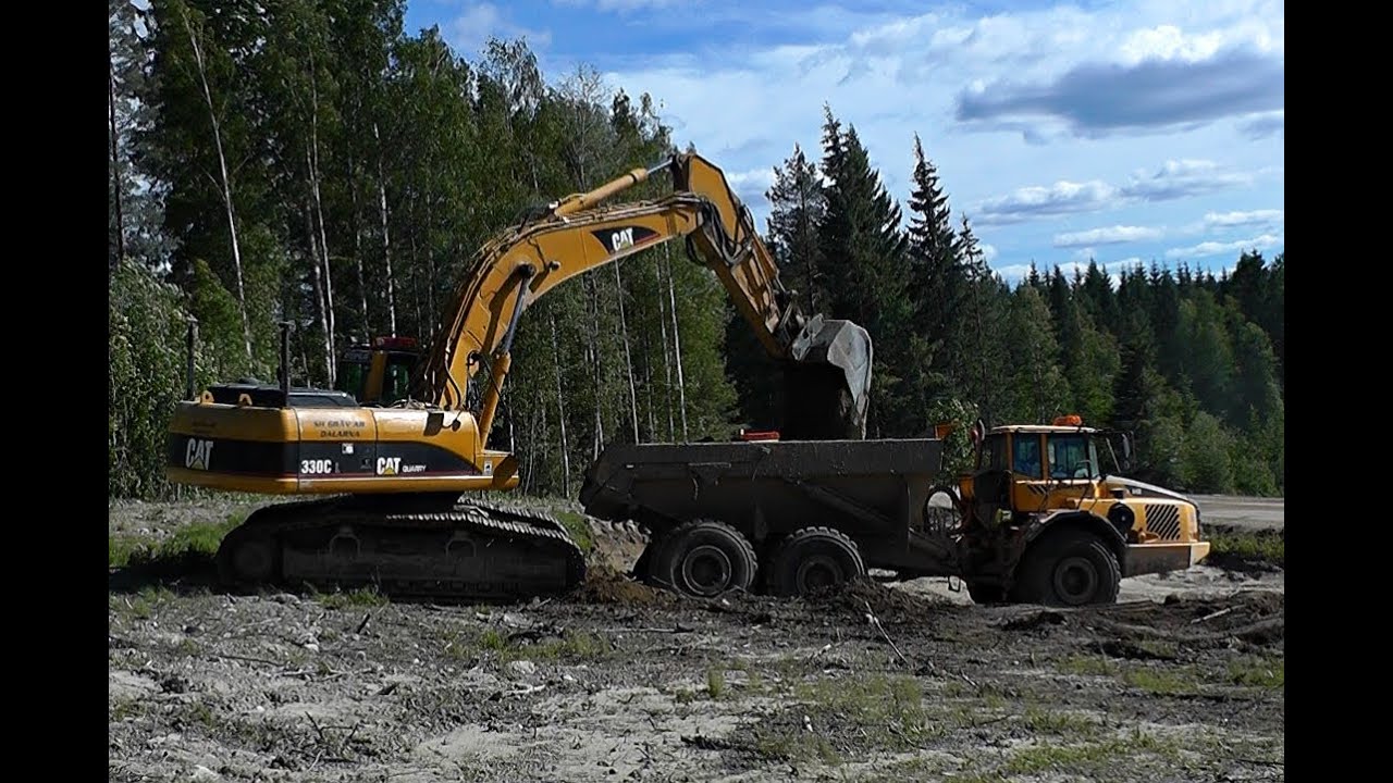 CAT 330CL Quarry Loading A Volvo A40E - YouTube
