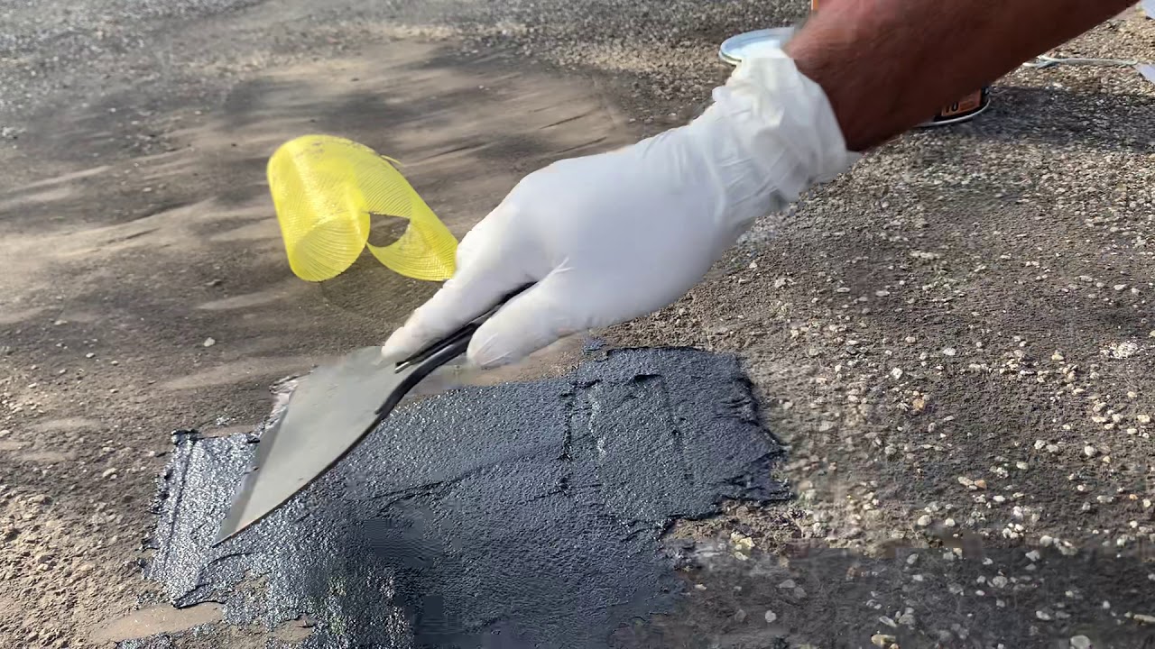 Patching a hole in tar and gravel roof - YouTube