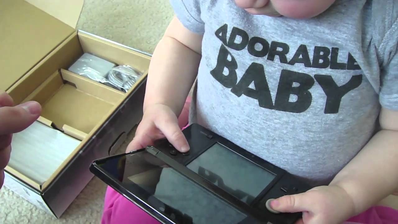 Watch a baby unbox a Nintendo 3DS - YouTube