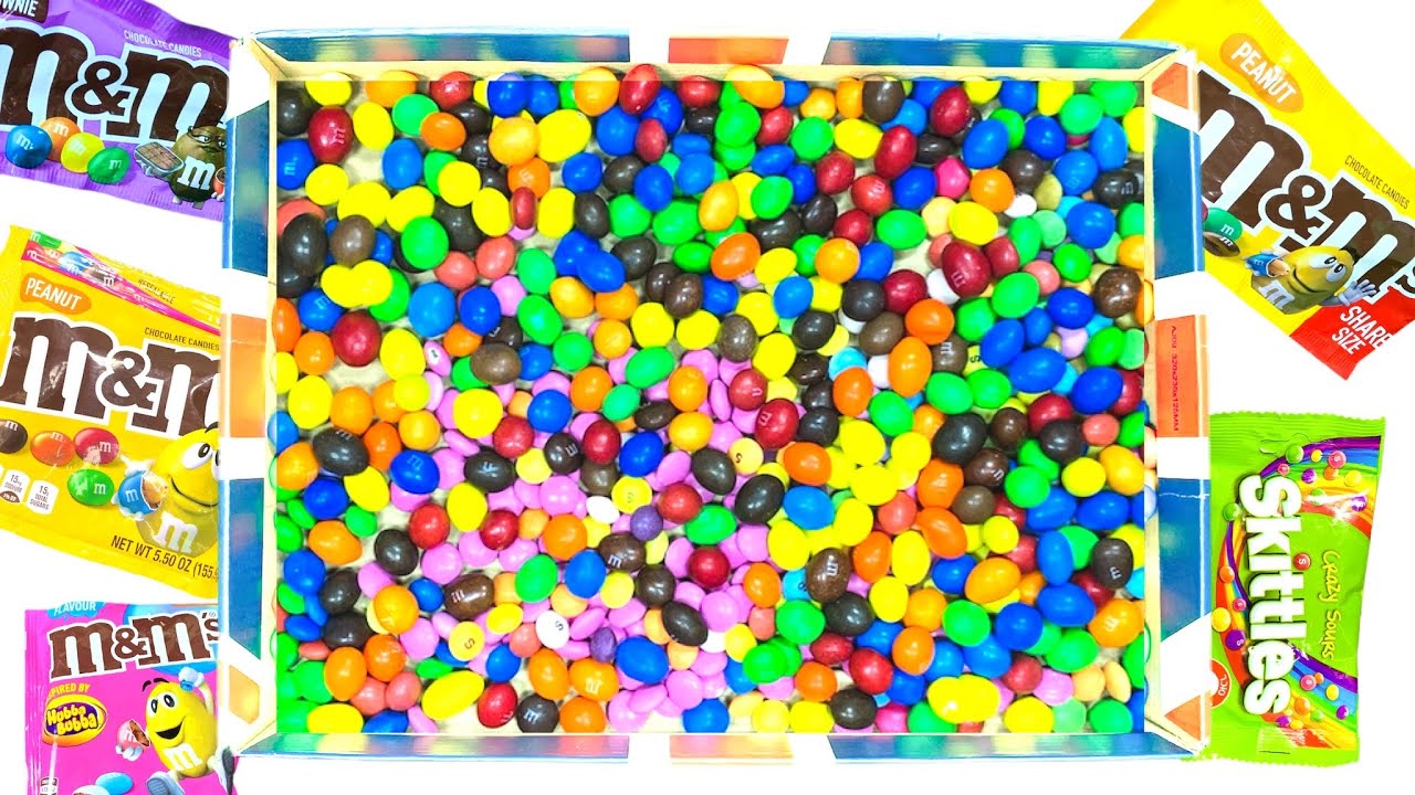 Mixing all my candy M&M's, Skittles, Smarties and other. Oddly ...