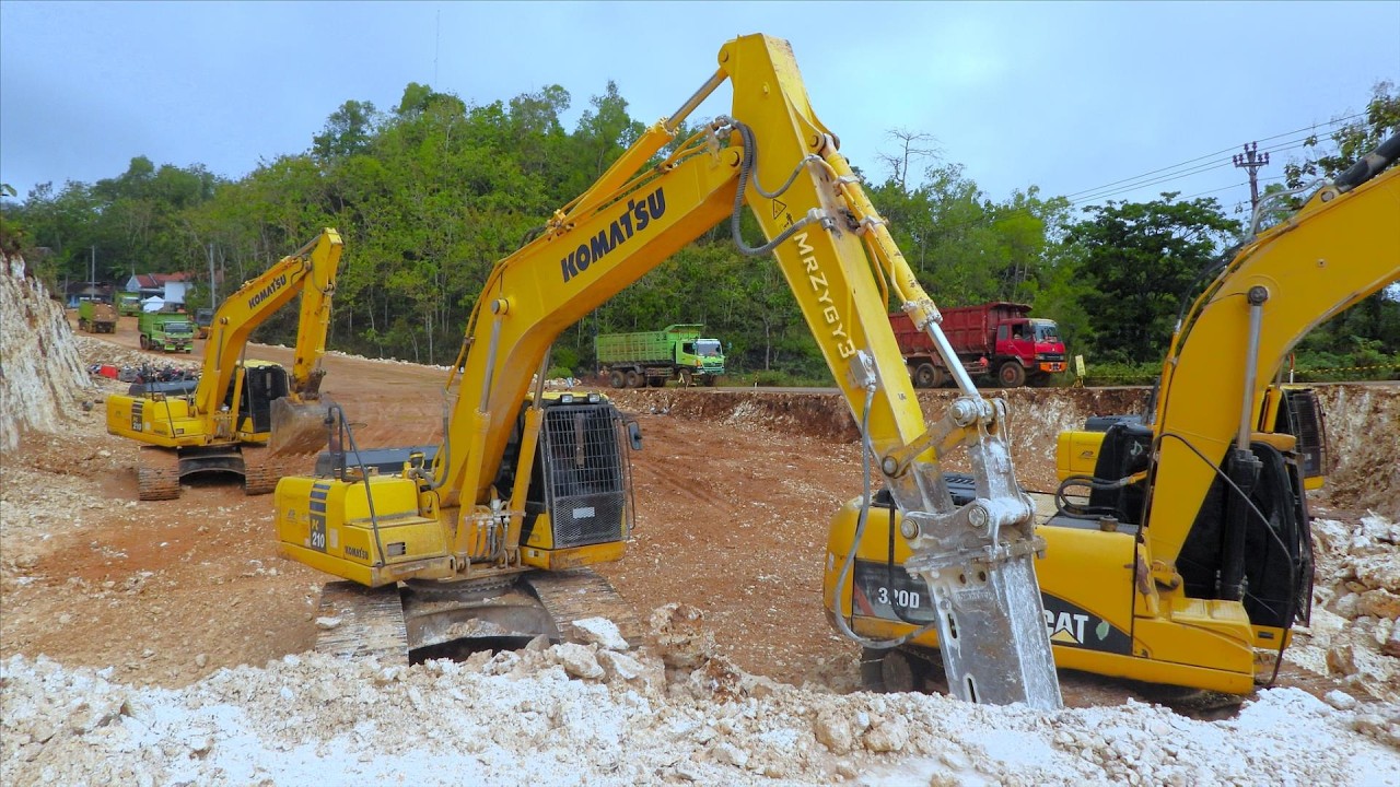 Excavators Trucks Working in Groups Excavating Limestone Hills to Make ...
