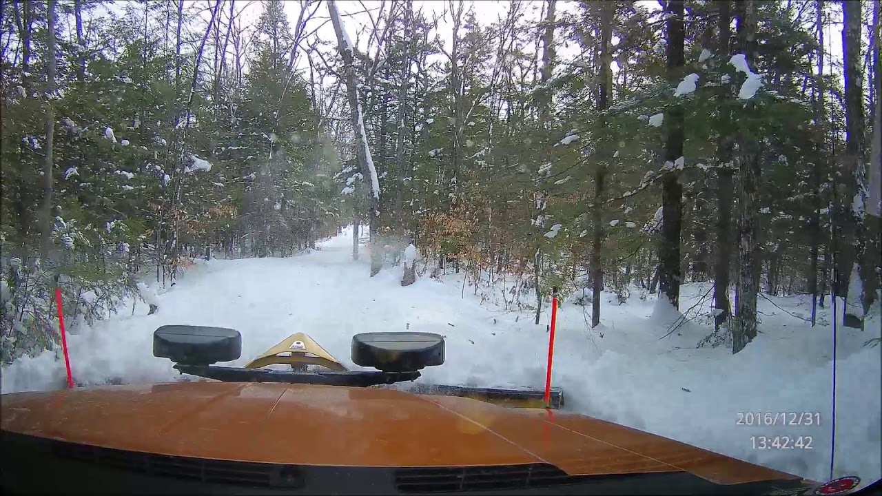Snow plowing opening up a driveway for the 1st time of the season - YouTube