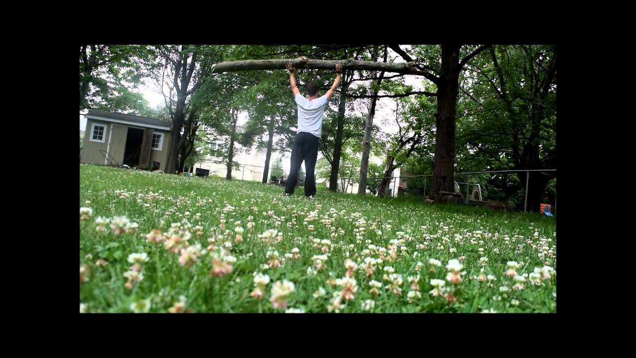 Ass to grass squats with a piece of tree - YouTube