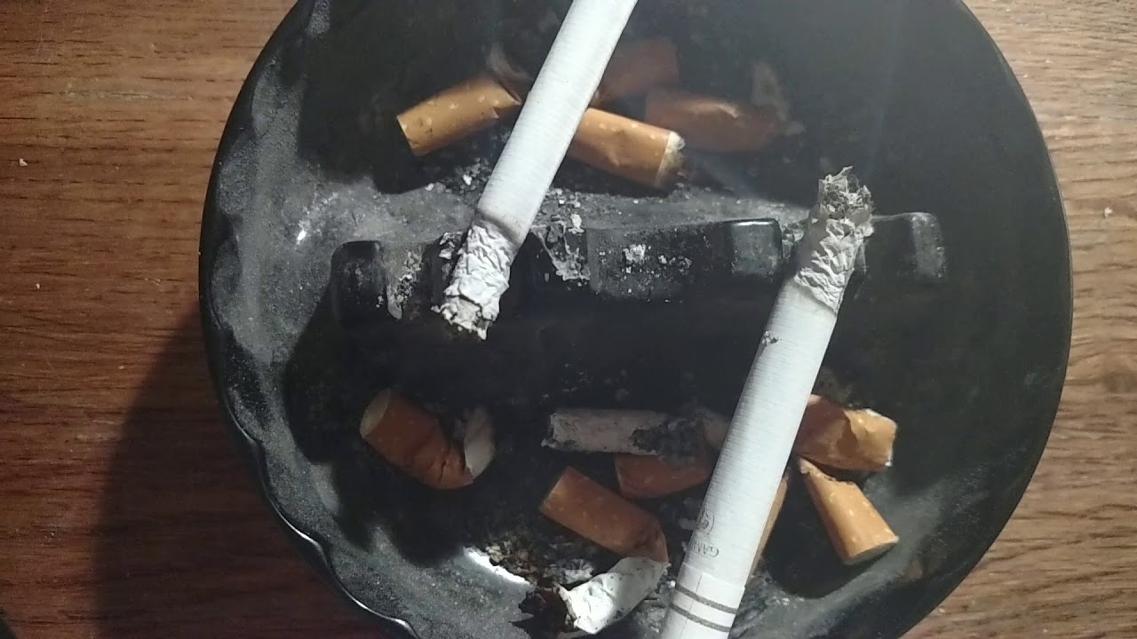 Burning cigarettes in ashtray - YouTube