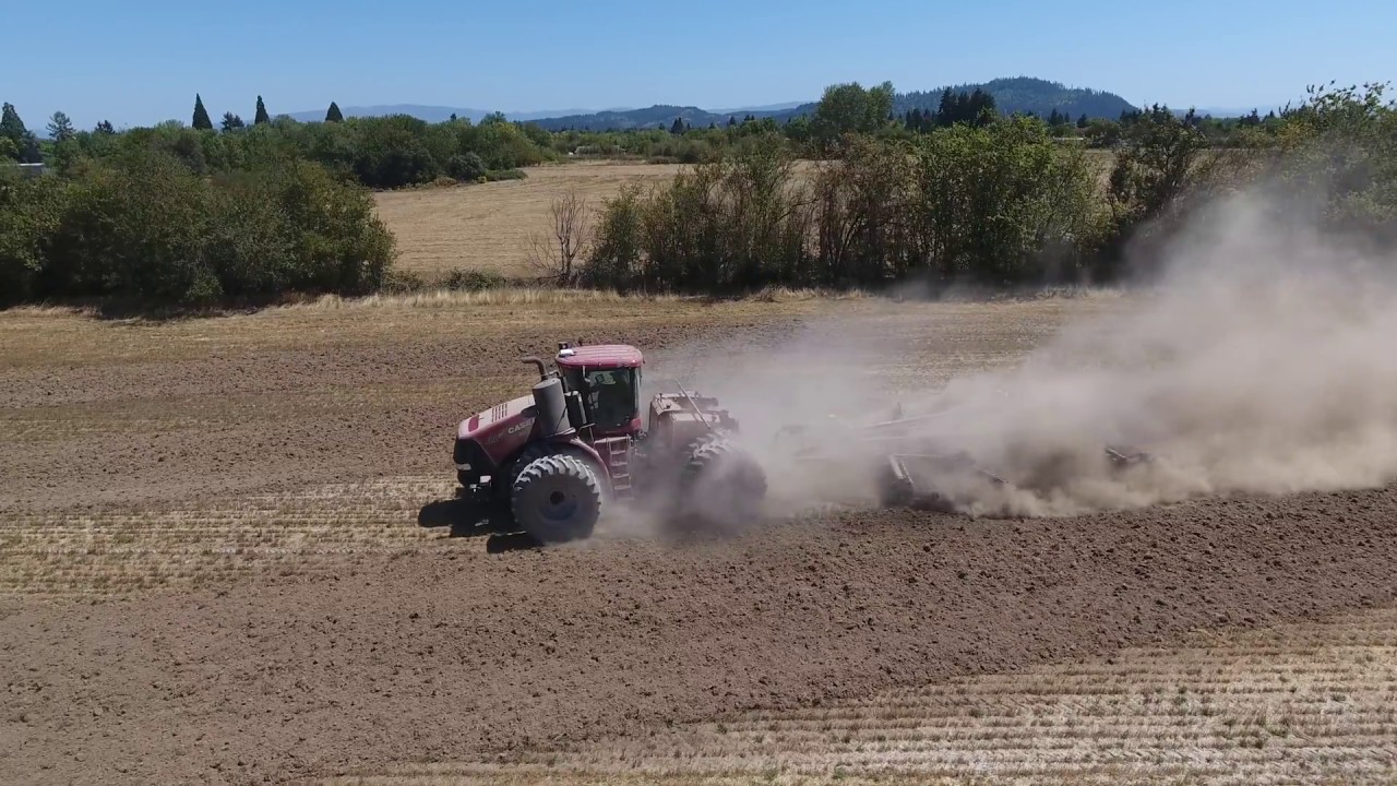 Case 580 steiger pulling 9 shank 875 disc ripper - YouTube