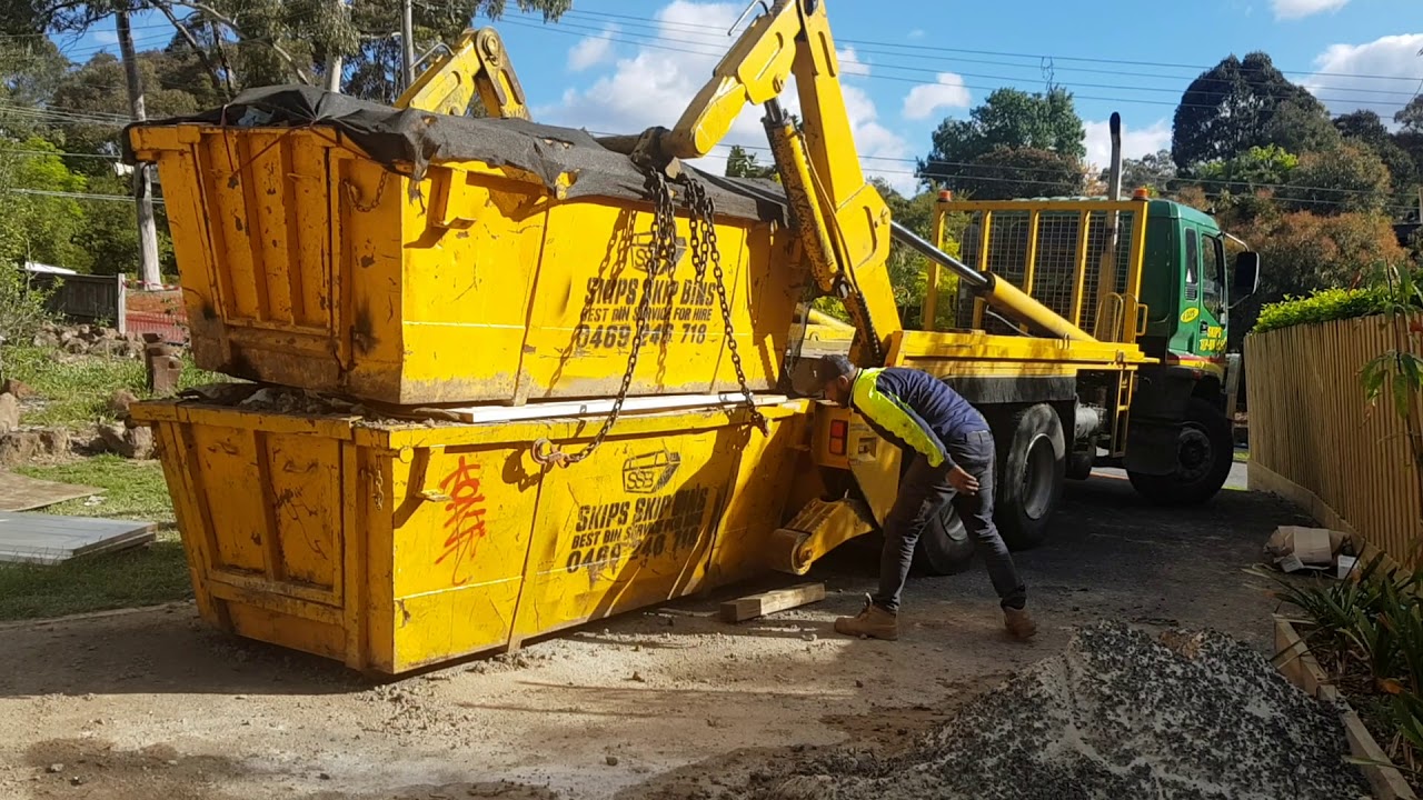 Loading Skip Bins onto Truck - YouTube
