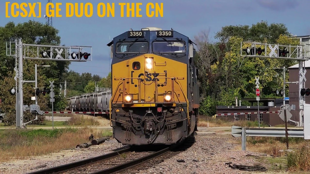 CSX GE Duo in YN3 Boxcar leads Canadian National Grain Train in ...
