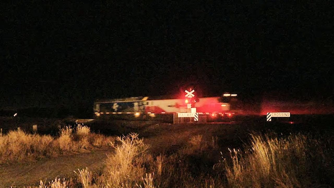 Passenger and Freight Train at a Level Crossing at Night - Australian ...