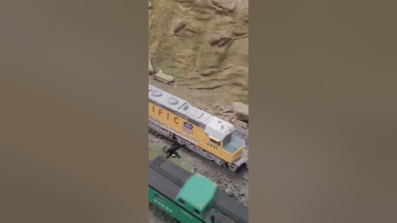 Union Pacific DDA40X 6901 and Amtrak 17 passing each other on the main line - YouTube