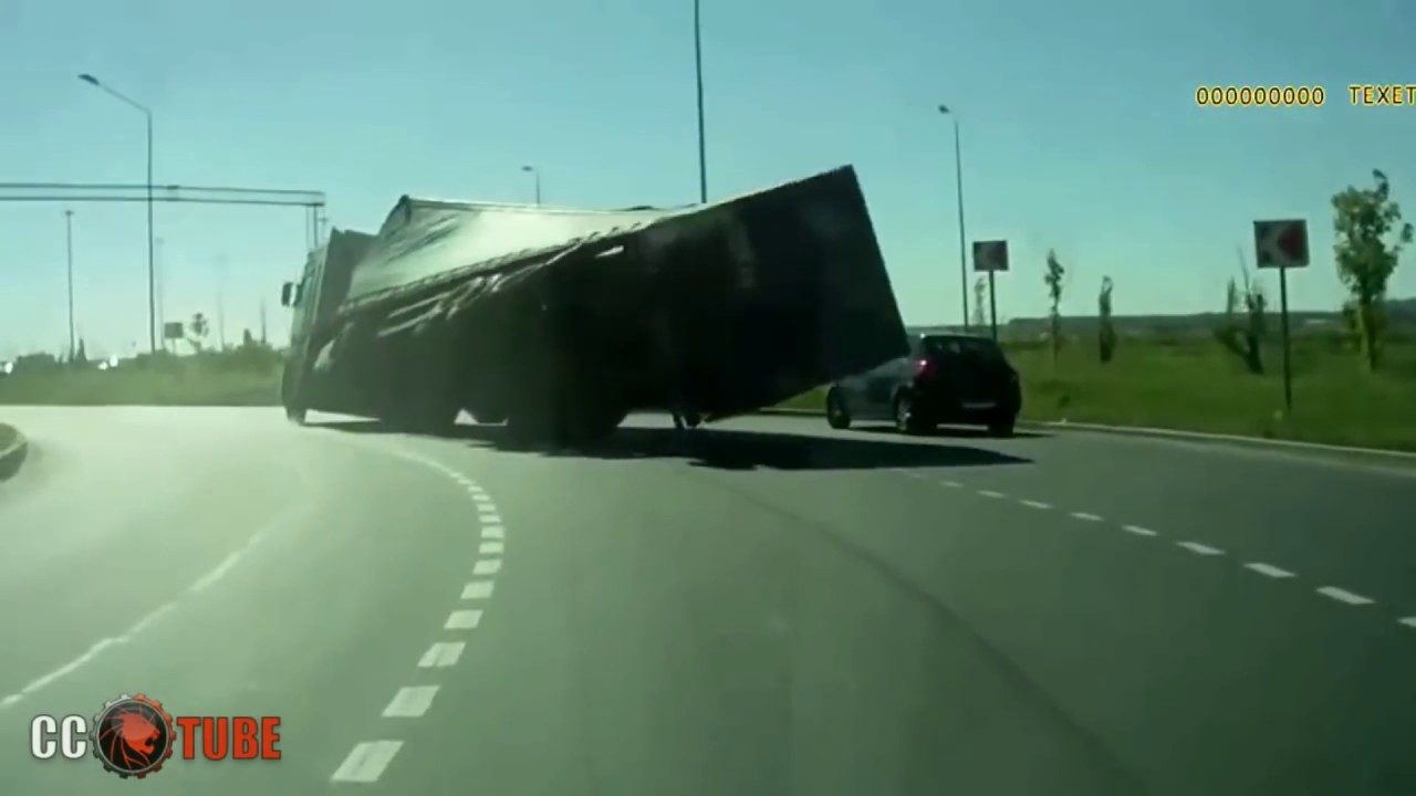 Semi Truck Fails To Turn On Roundabout And Rolls Over - YouTube
