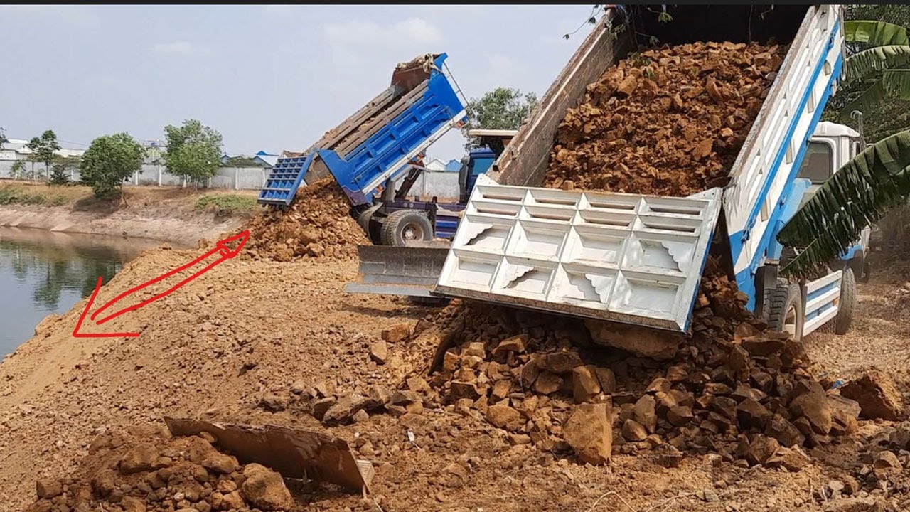 Land Filling Process 5T Dump Truck Unloading Land And Dozer Working ...