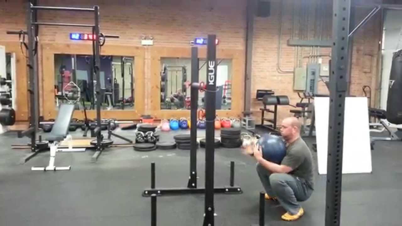 Heavy med ball lifts over the yoke - YouTube