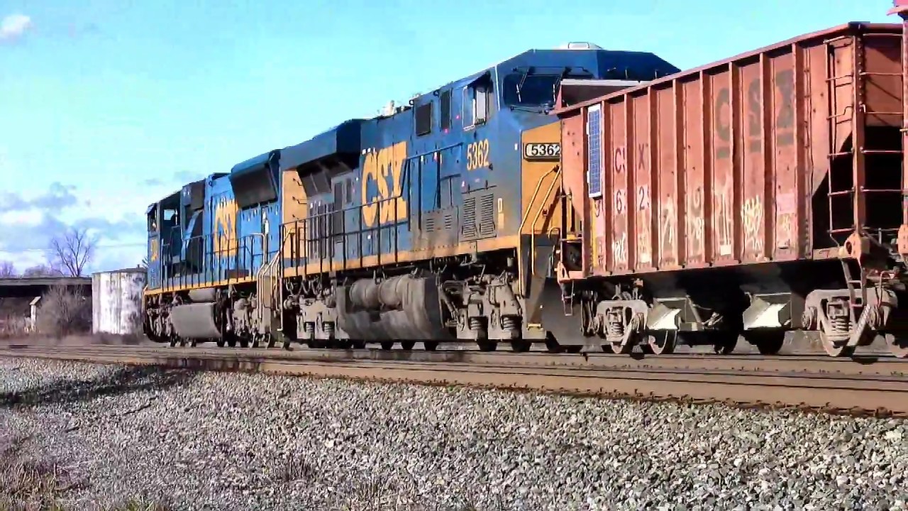 CSXT ballast train dumping ballast with solar powered hopper cars, 2010 ...
