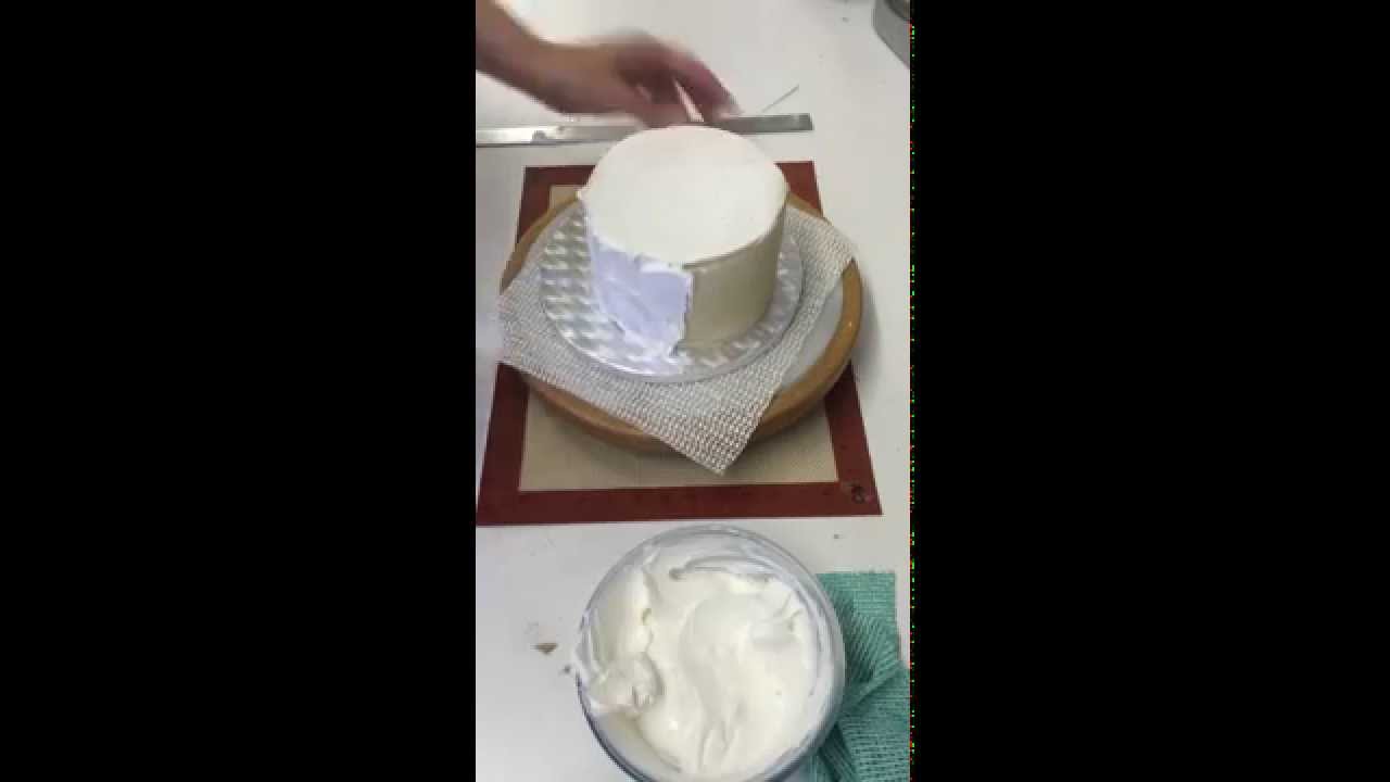 Coating a cake with royal icing (1st layer) - YouTube