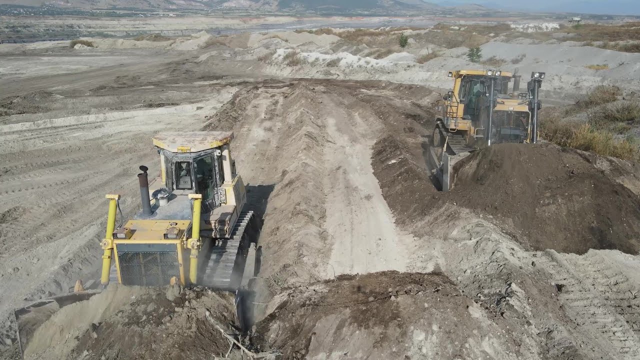 Caterpillar D9T And Komatsu D275 Bulldozers Pushing Soil On Huge Mining ...