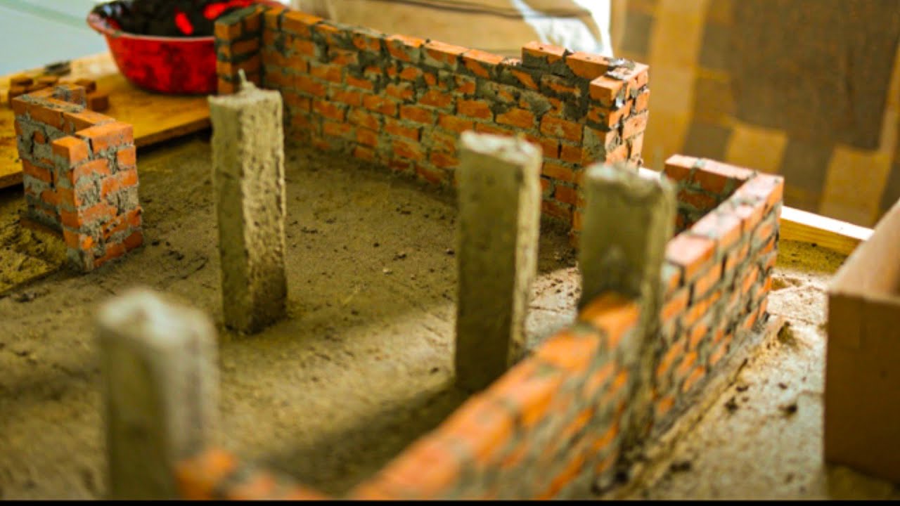 Building mini-brick walls of a miniature house. DIY high-tech mini ...