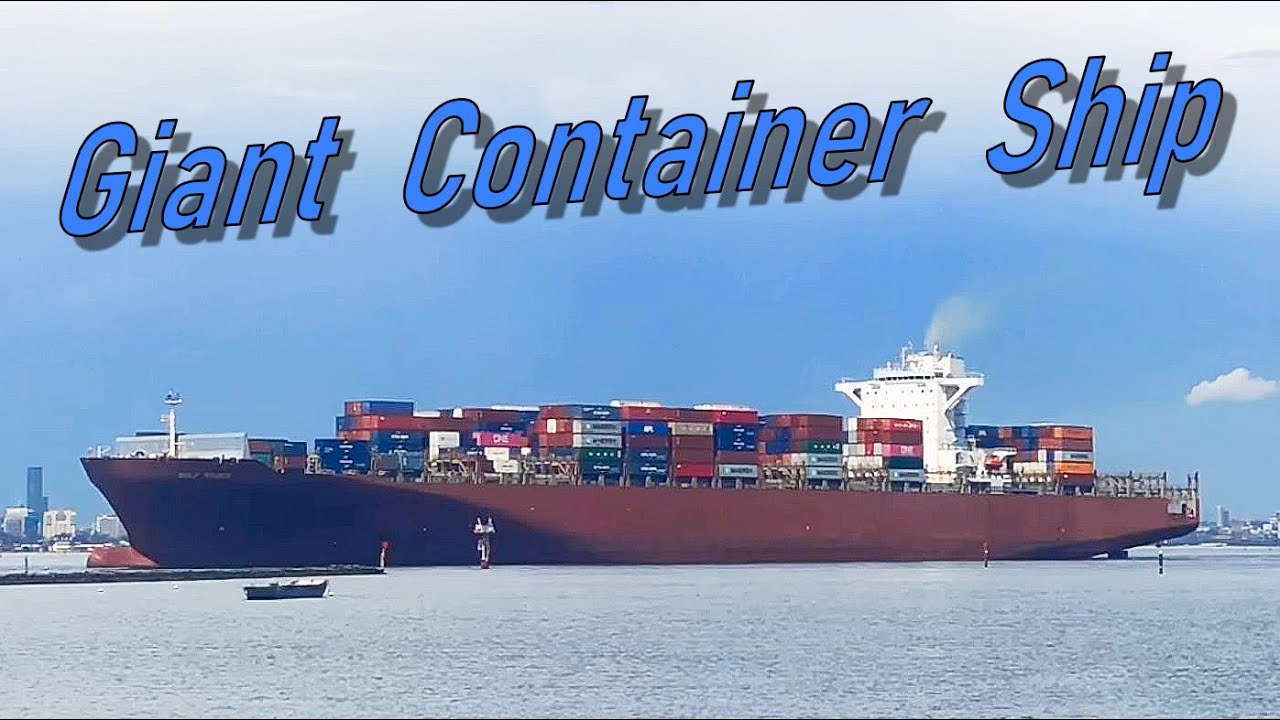 The enormous container ship GULF BRIDGE (335m X 42.8m) docks at Webb ...