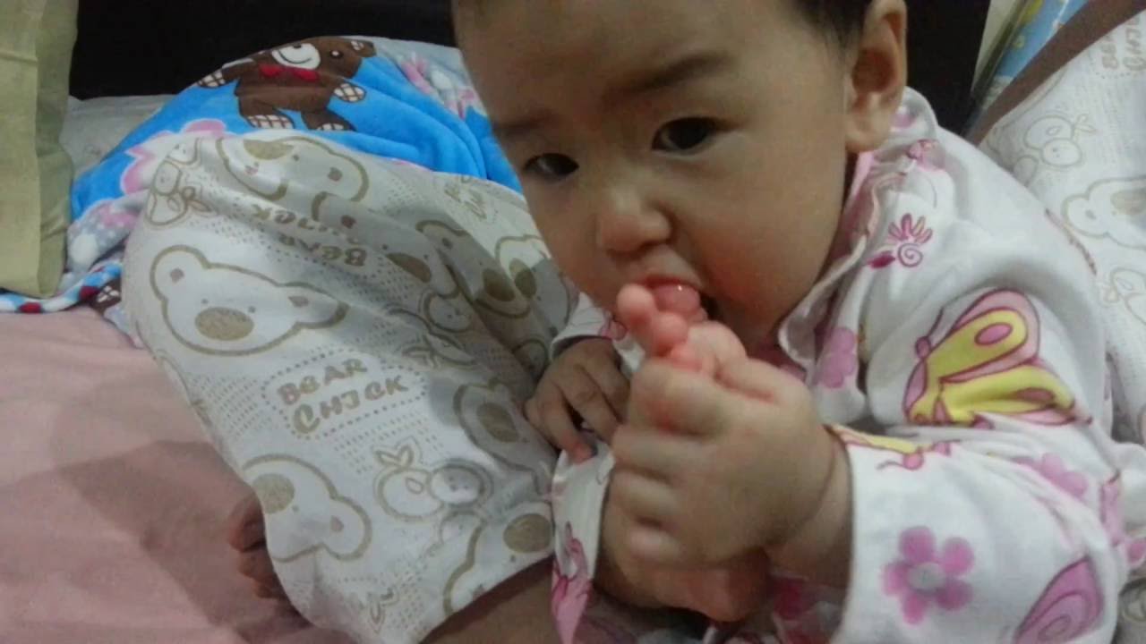 Funny baby eating her foot - YouTube