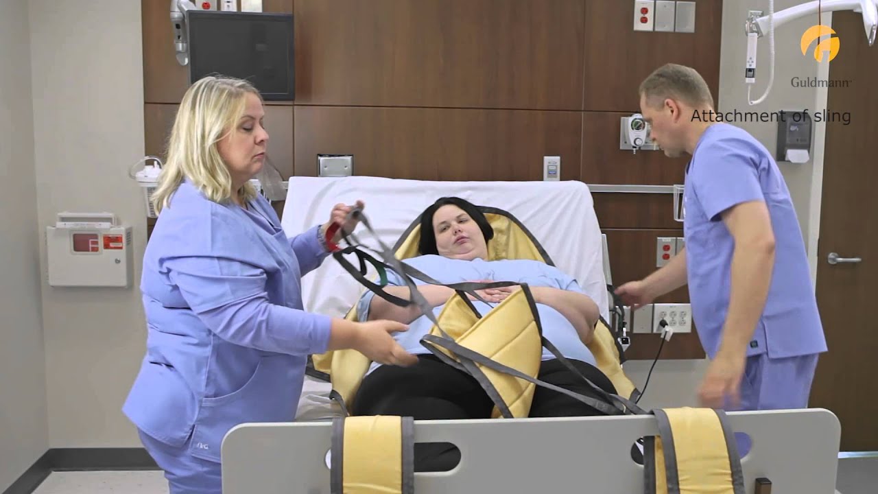 Guldmann Ceiling Lift: Bariatric Basic High - Lifting from bed to chair ...