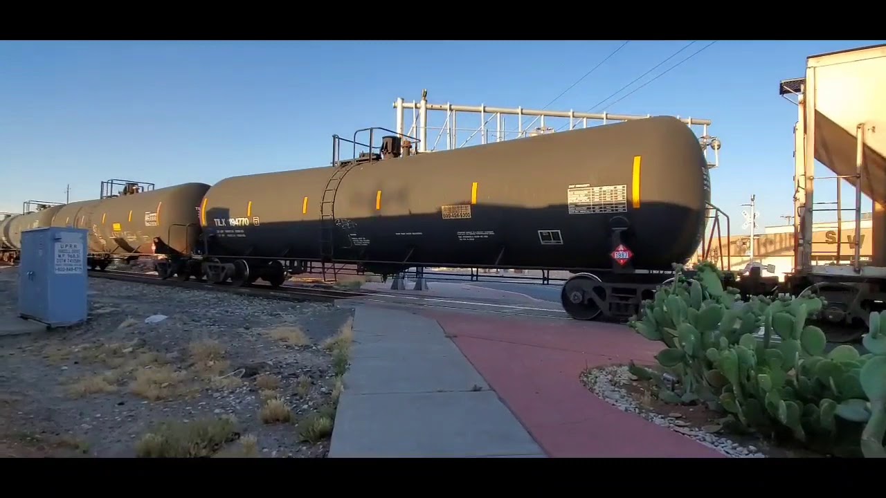 Westbound Union Pacific manifest train with a rear DPU read description ...