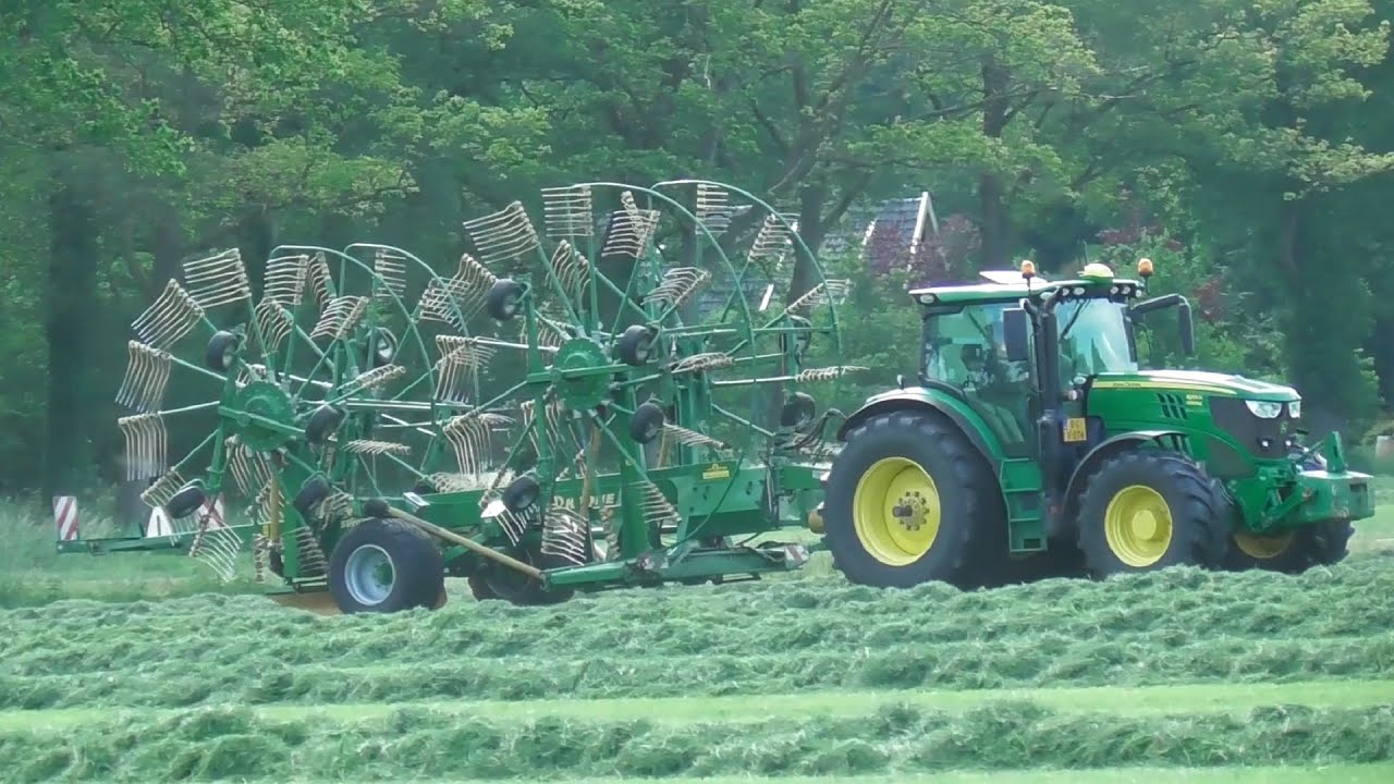 Raking silage with John Deere & Krone - YouTube