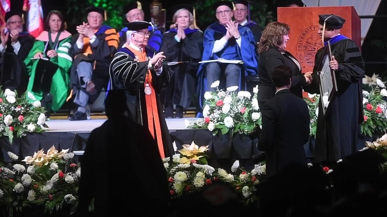 Mother accepts posthumous degree for son at UT graduation - YouTube