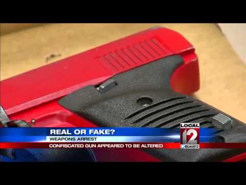 Red handgun confiscated by police resembles toy gun - YouTube