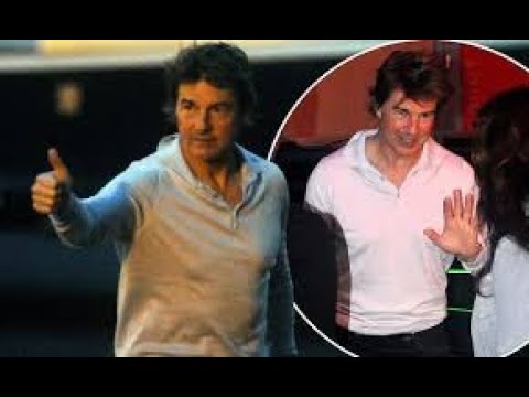 Tom Cruise, 62, gives a thumbs up as he touches down at Battersea in ...