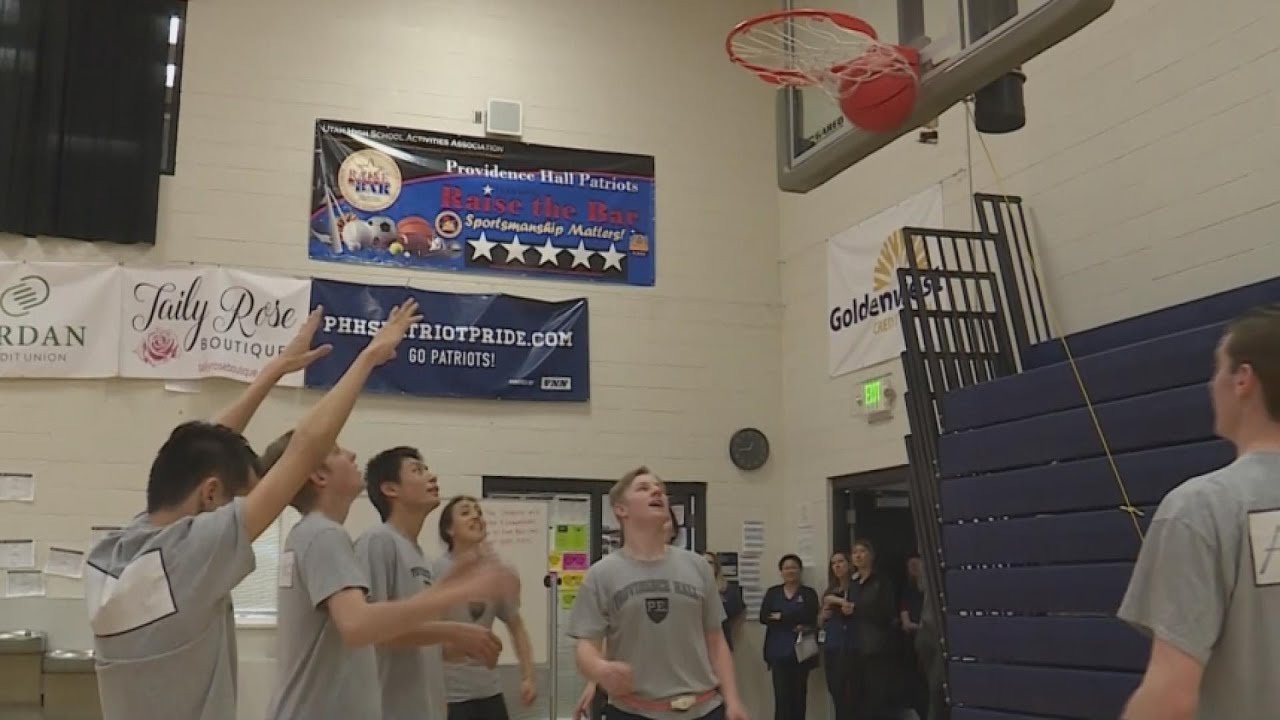 Beeping hoop helps blind boy play basketball - YouTube