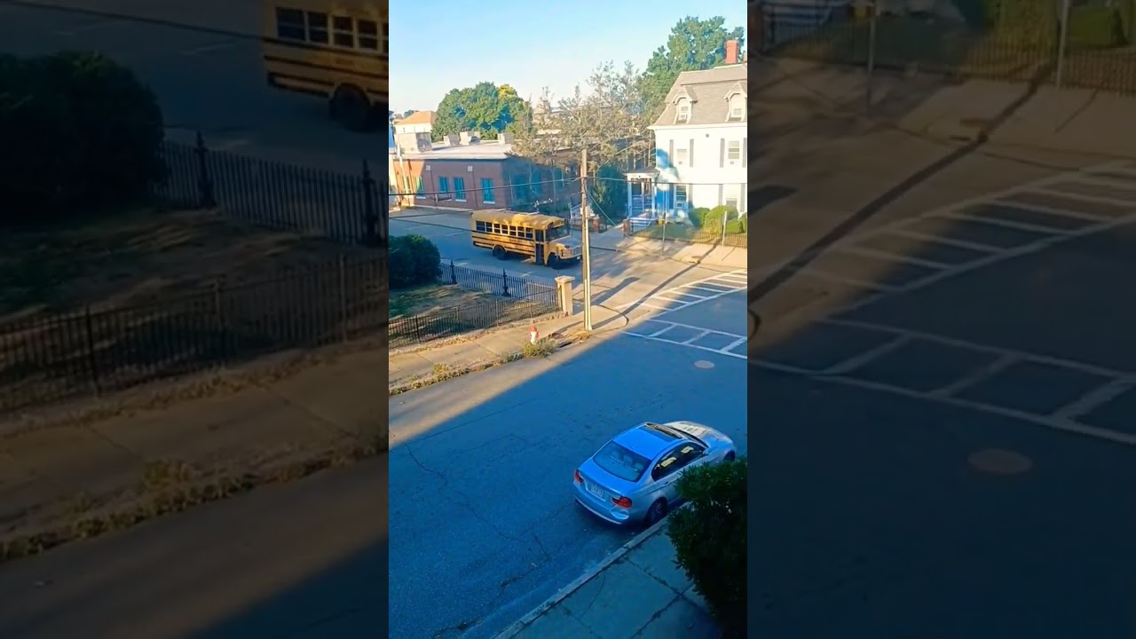 School bus driving fast down main street - YouTube