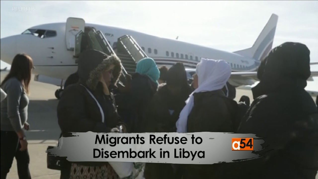 Migrants Refuse to Disembark in Libya - YouTube