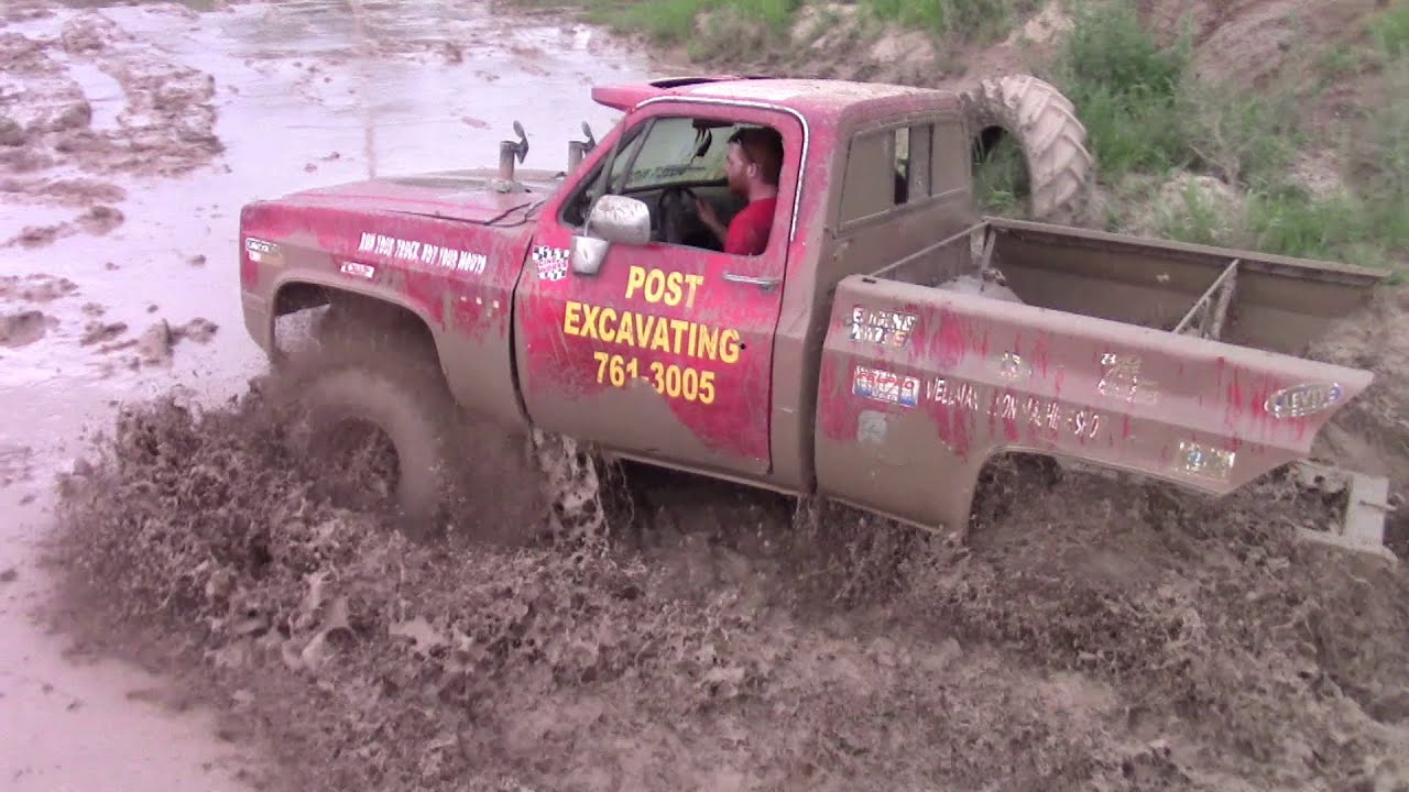 2 Red Trucks Mudding At Orleans Michigan Mudfest Spring 2016 - YouTube