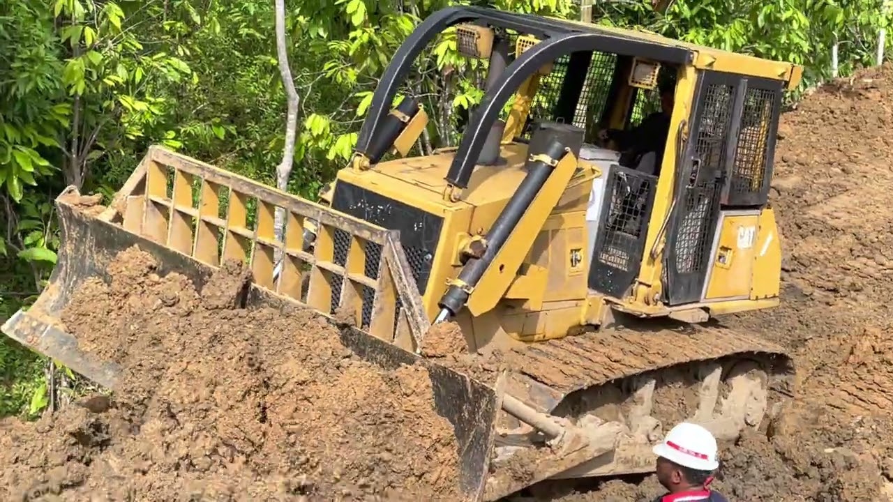 Bulldozer cutting the ground at giant dam project - YouTube