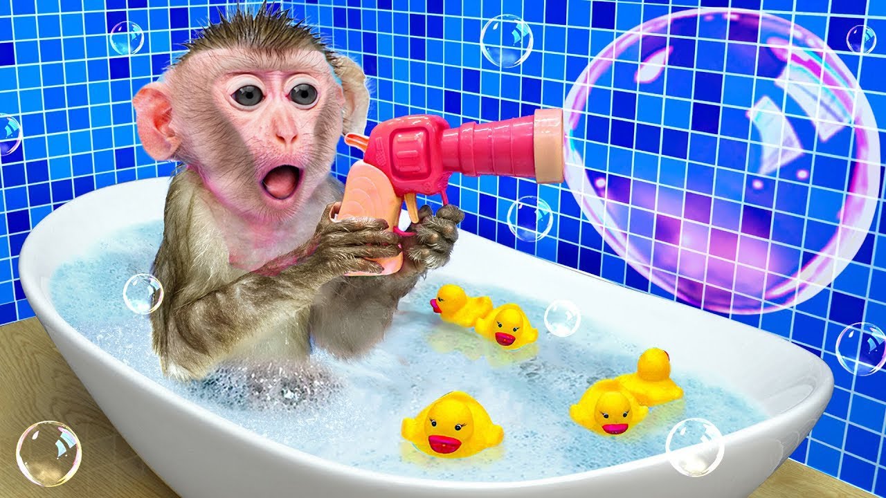 Monkey Baby BiBi playing Giant Bubble in Bathtub with Duckling in the ...
