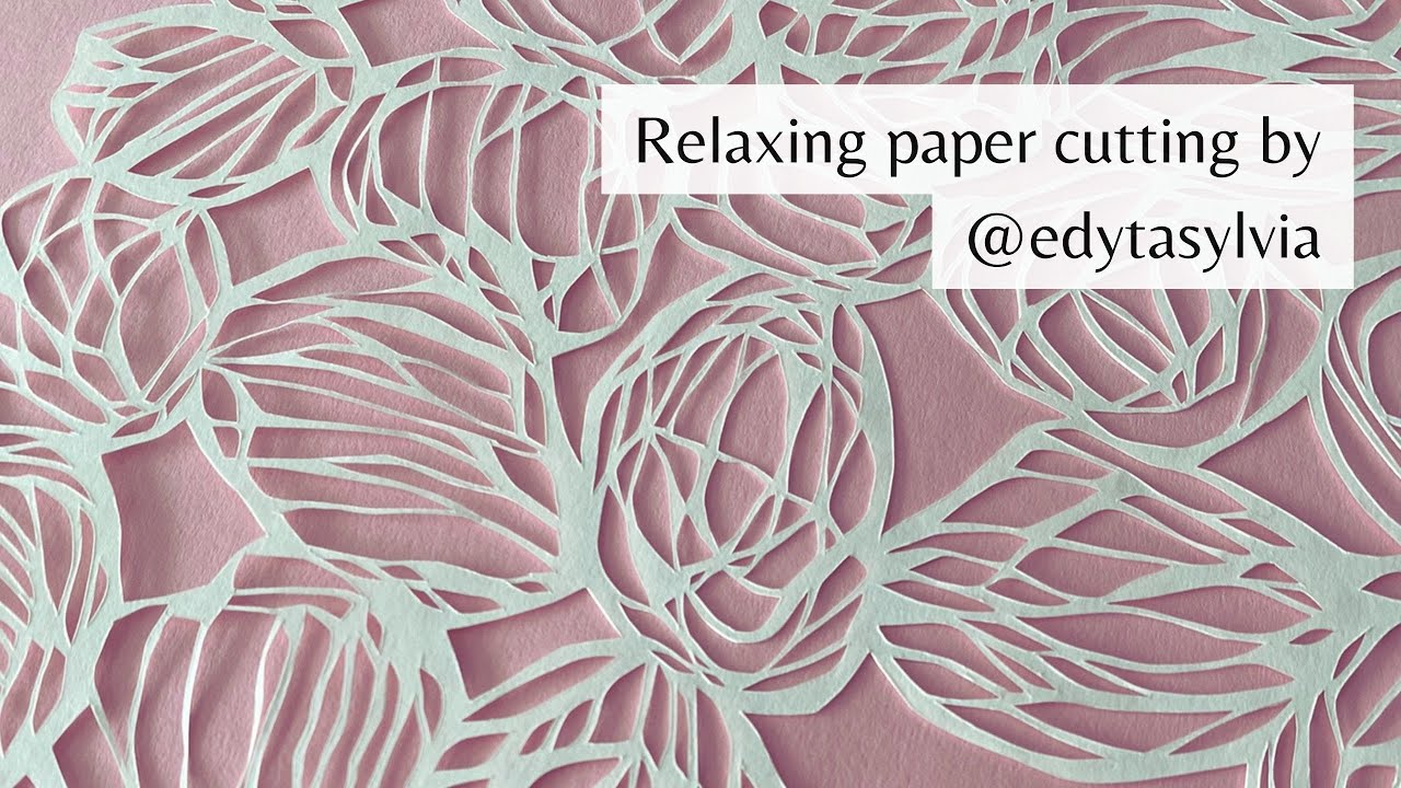 Relaxing paper cutting. Creating an abstract paper cut piece with white ...